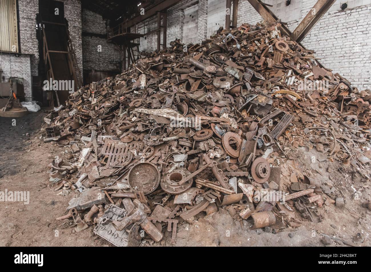 A bunch of old dirty rusty metal and iron waste to recycle in a ...