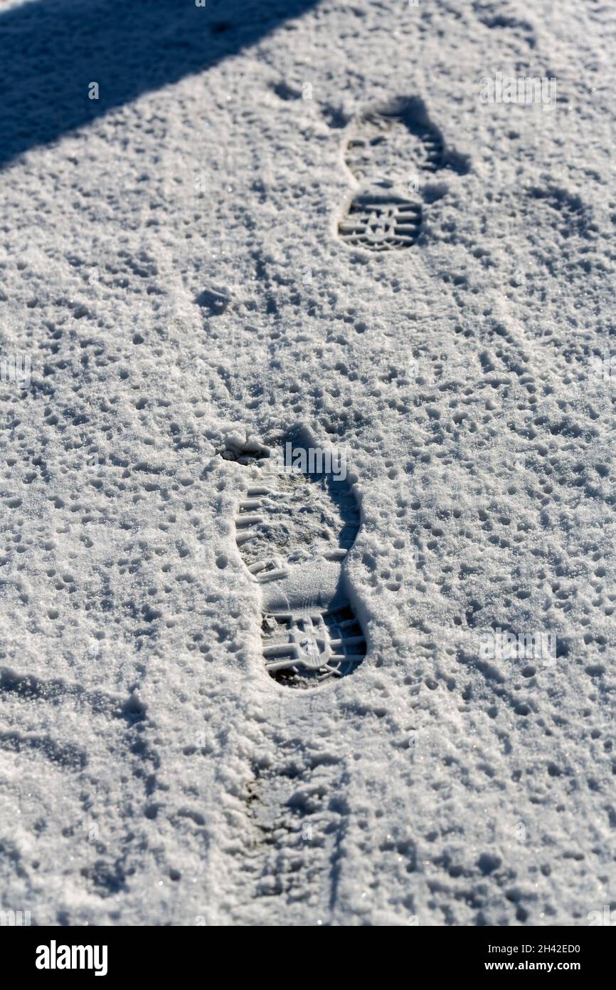 Closeup of footsteps in snow going forward. Exploring, adventure ...