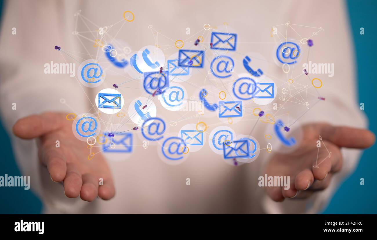 A hand holding email icons-communication and feedback concept Stock ...
