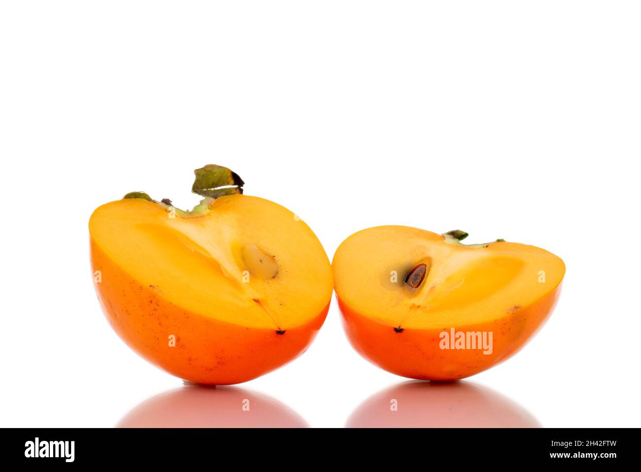 Two halves of sweet persimmon, close-up, isolated on white Stock Photo ...