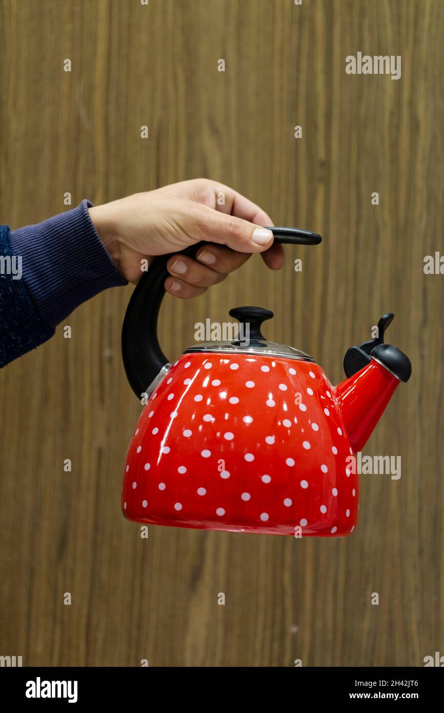 Man Hand Holding Metal Kettle In The Kitchen. Design. Kitchen. Useful ...