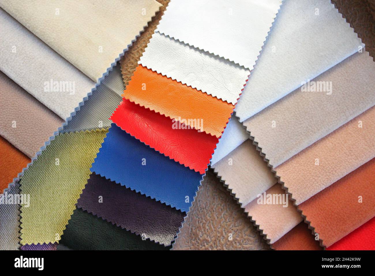 Samples of colorful upholstery fabrics. Various texture and colors ...