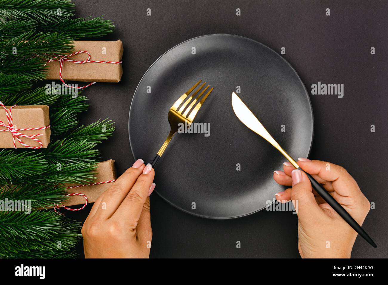 Hands holding knife fork hi-res stock photography and images - Alamy