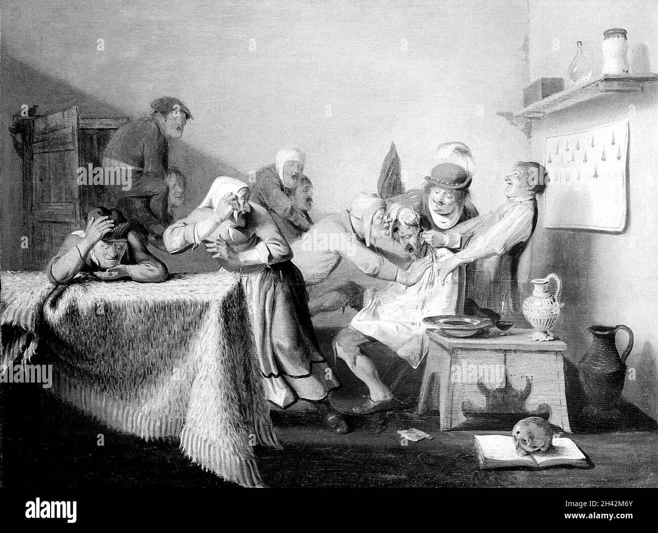 An operator making an incision behind the ear of a seated patient, two ...