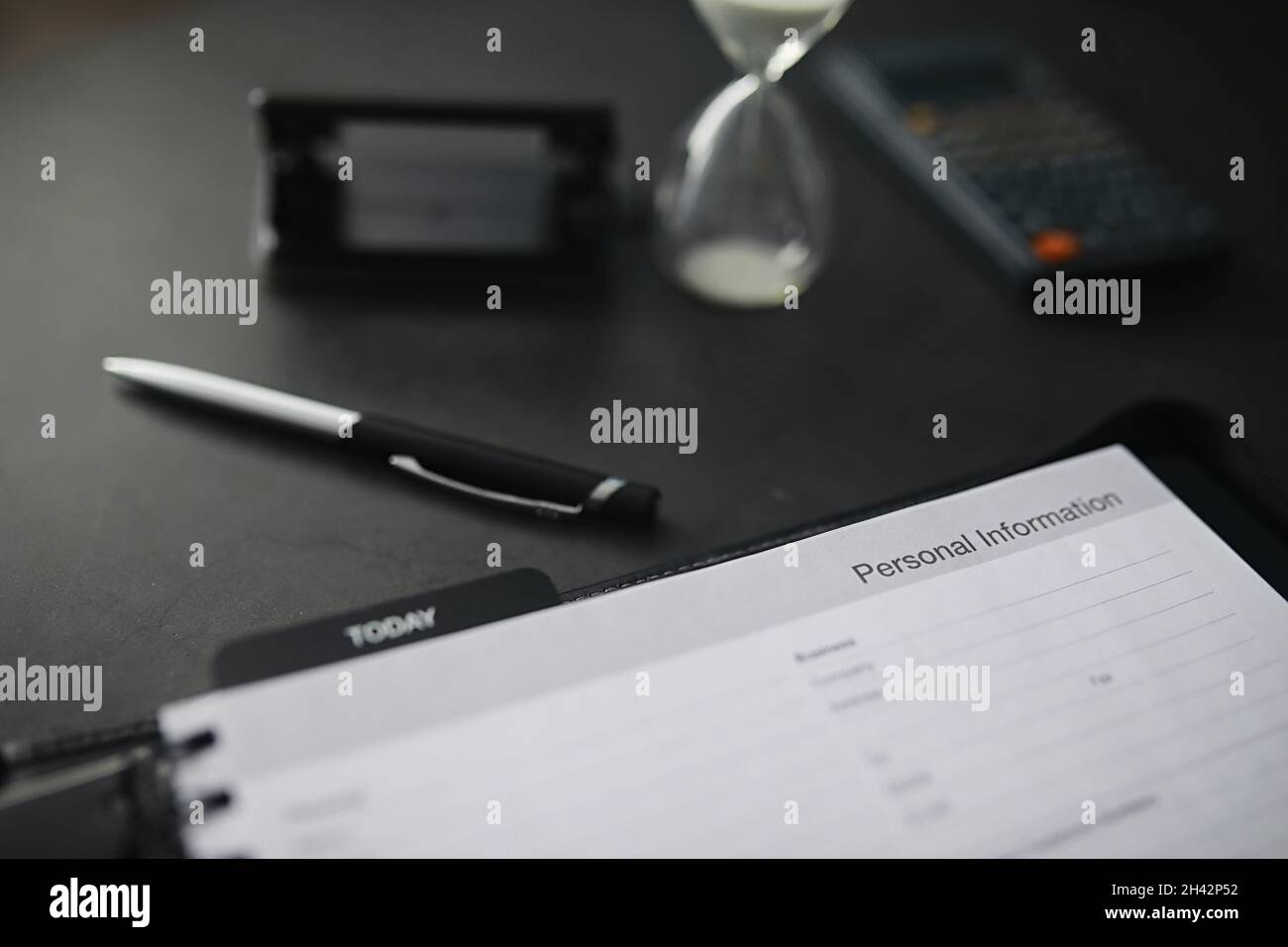 Filling out a form with personal information. Documents in a folder on ...