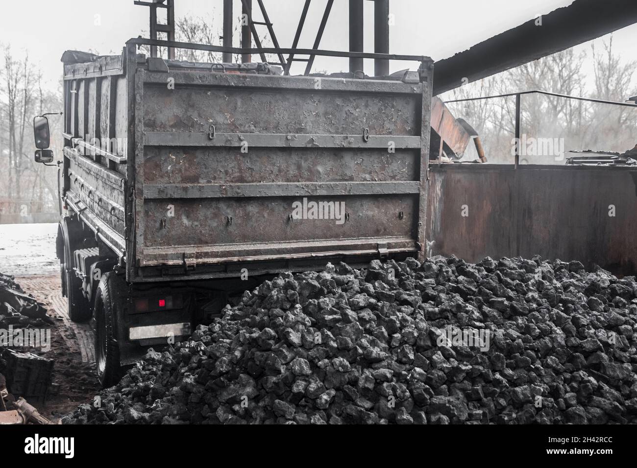 The dump truck unloaded a pile of coking coal from the body in the ...