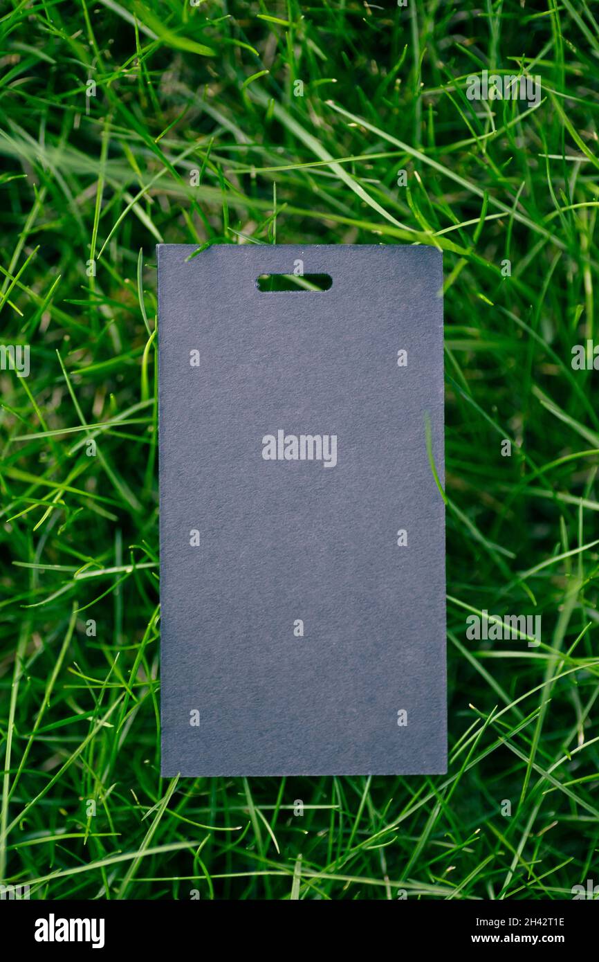 Top view of one black price tag for clothing creative layout of lawn ...