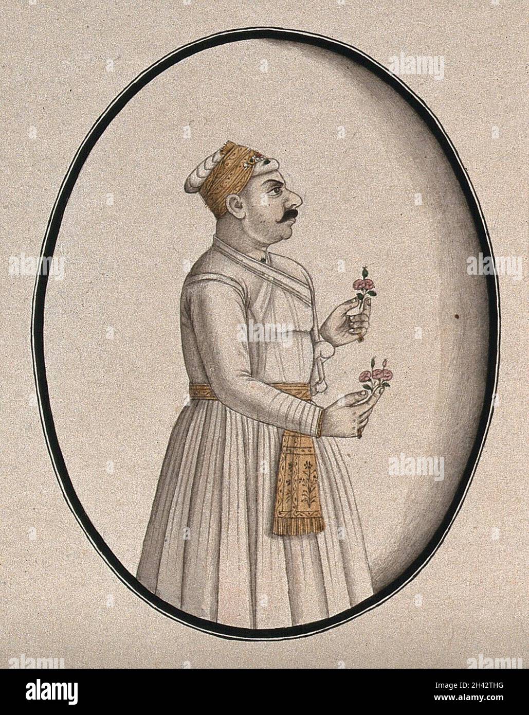 A Mughal courtier holding a flower in each hand. Watercolour drawing by ...