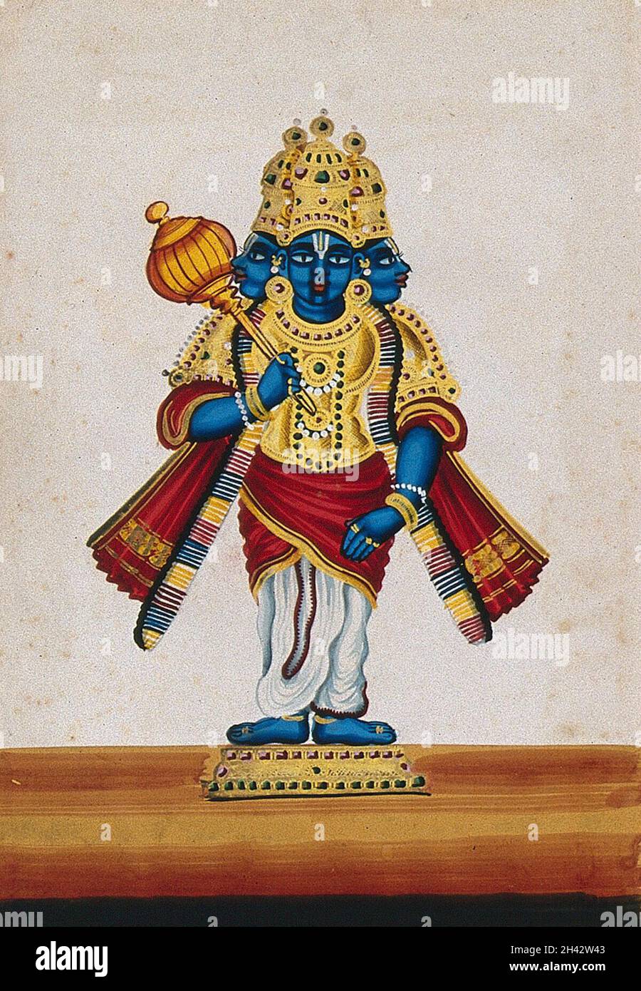 A three-headed, blue-skinned statue of an Indian deity (Vishnu ...