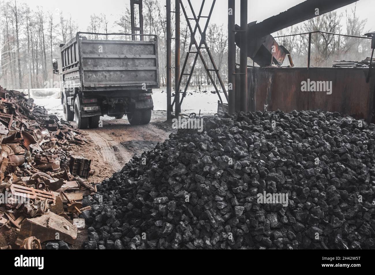A dump truck at a landfill or on an industrial site unloaded a pile of ...