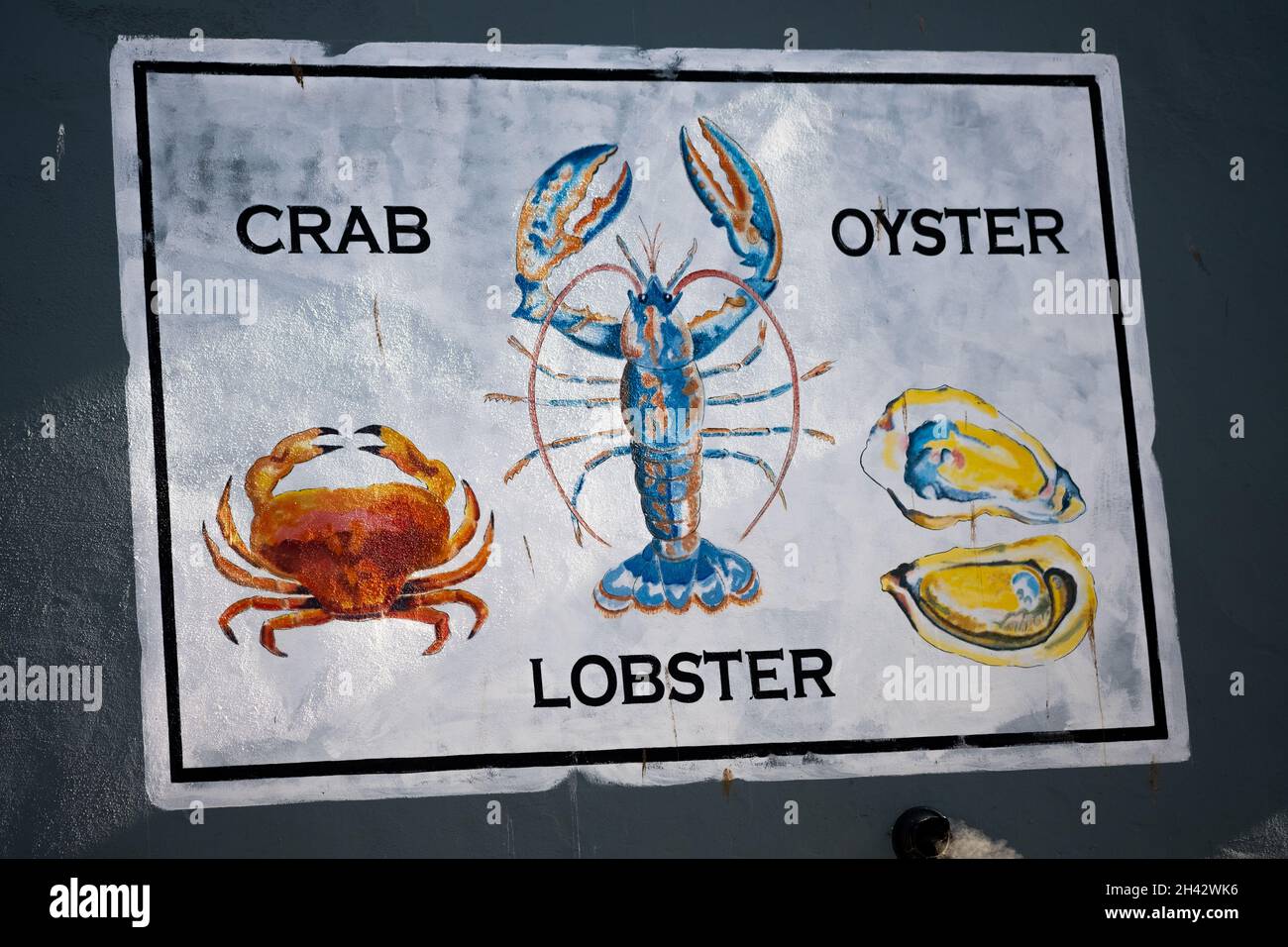 The decorative advertisement sign on the side of a fishmonger outlet ...