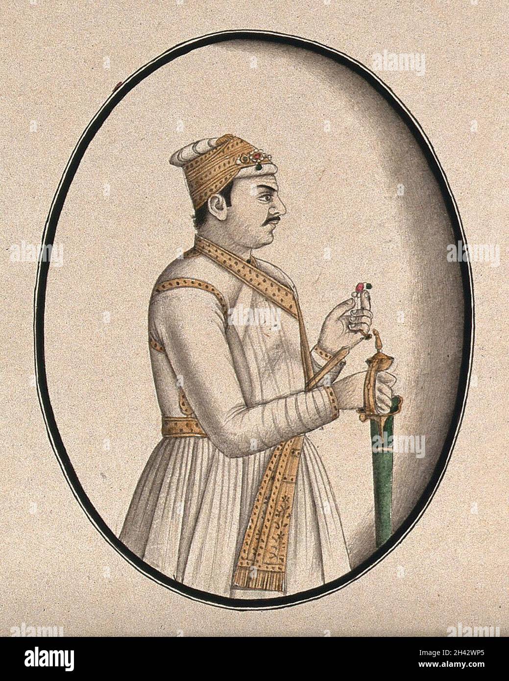 A Mughal courtier holding a green sword and a flower (?). Watercolour ...