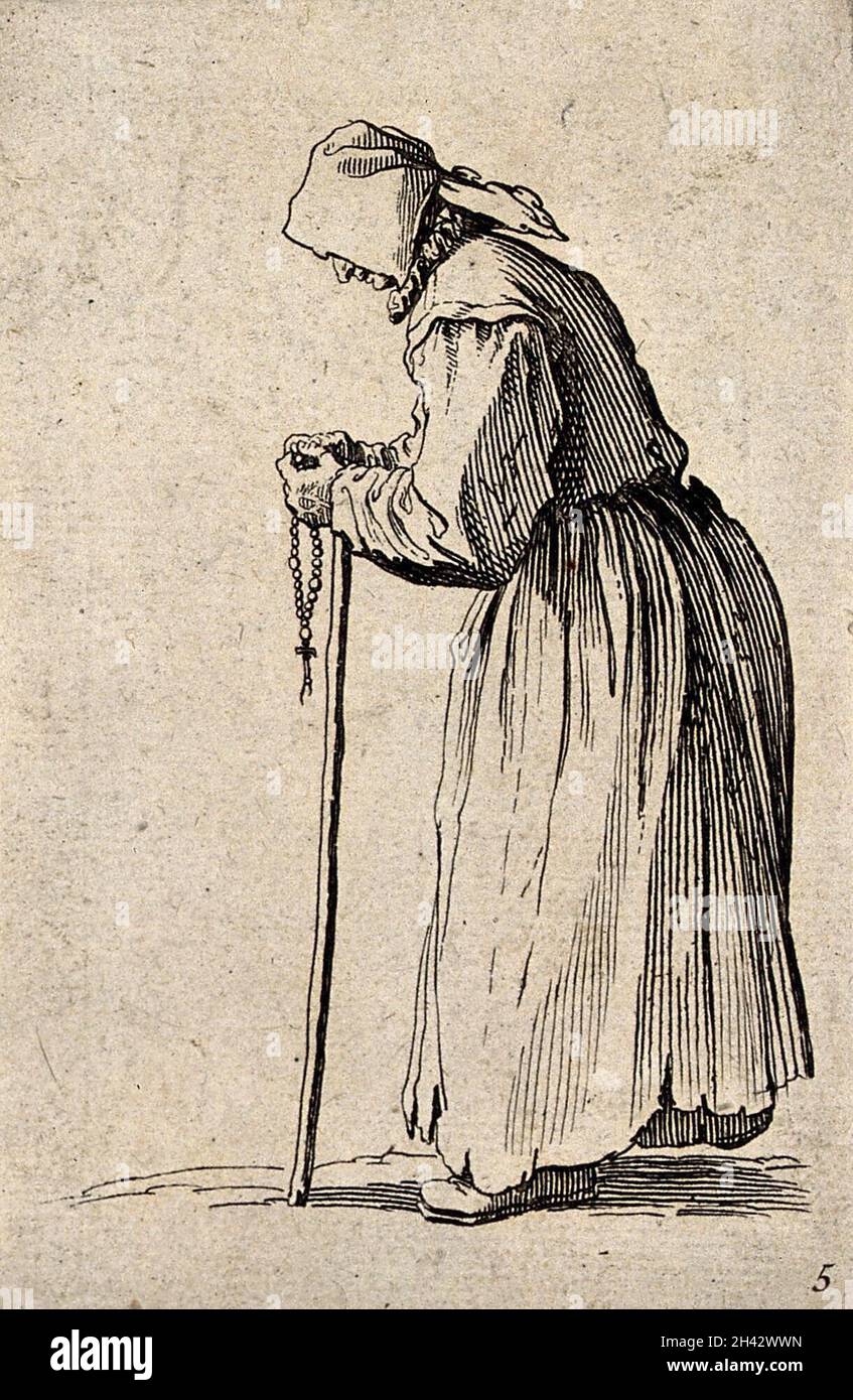 An old woman dressed in rags holding a rosary in her left hand and a ...