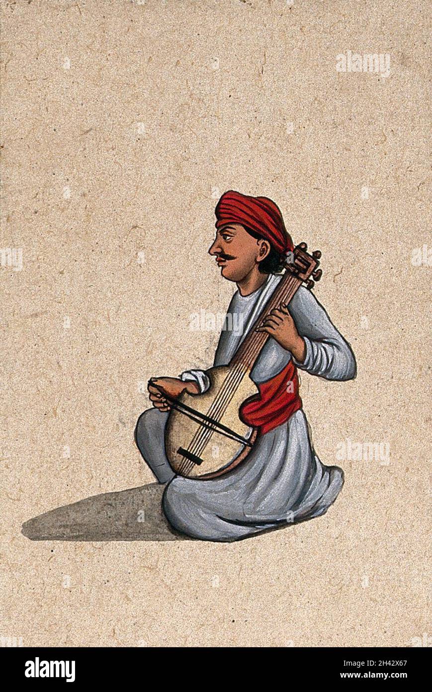 A musician playing an Indian stringed instrument, similar to the ...