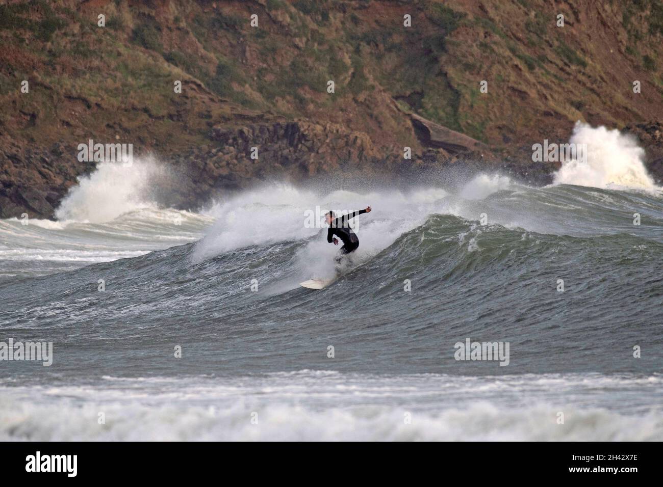 Swansea, UK. 31st Oct, 2021. Surfers enjoying the waves at Langland Bay ...