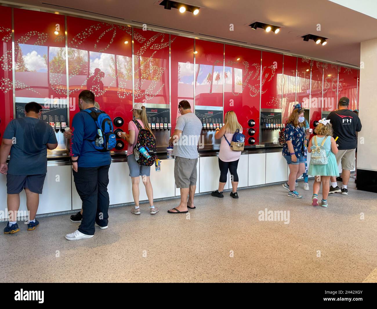 Orlando, FL USA - October 9, 2021: People pouring soda from a sample ...