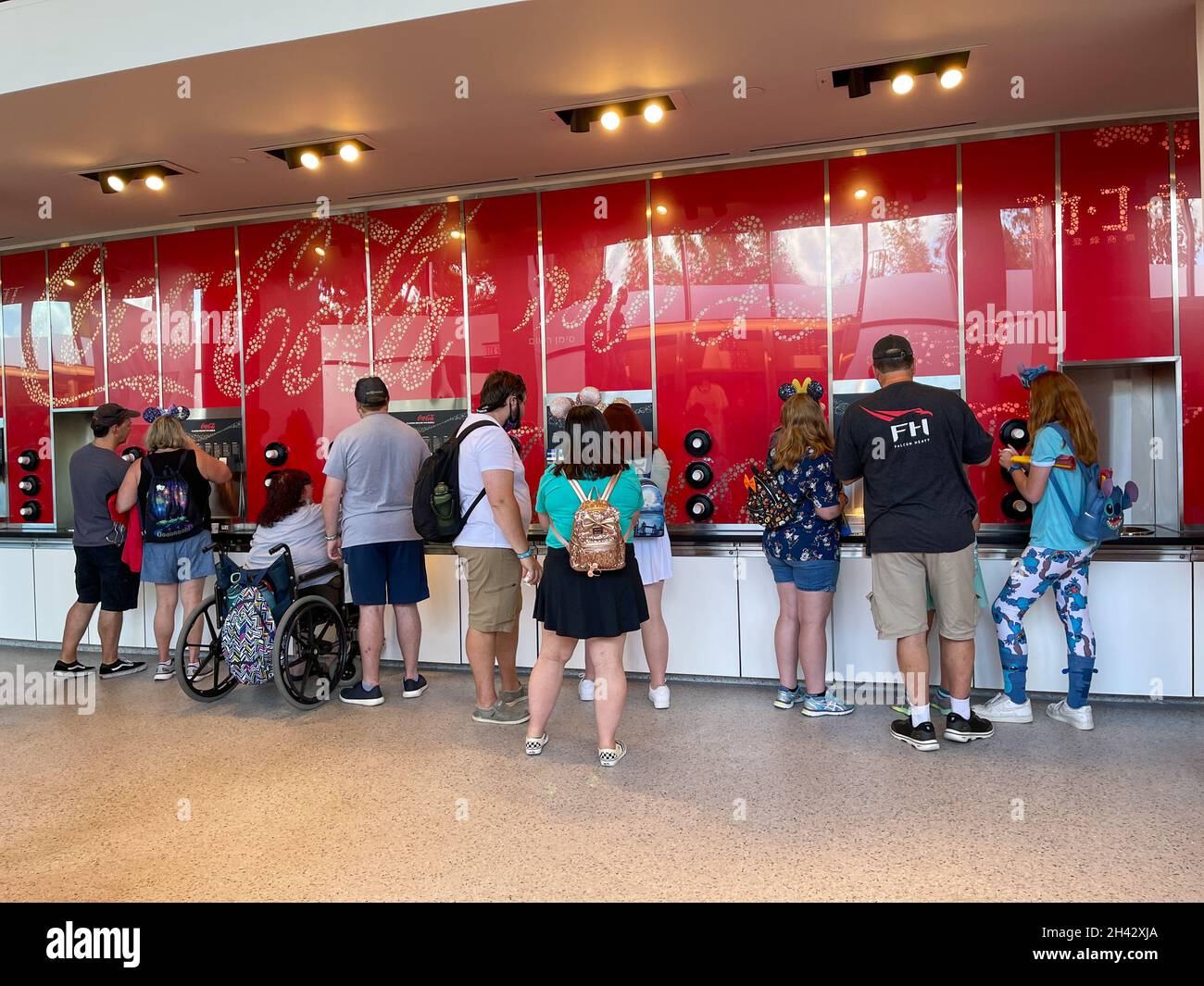 Orlando, FL USA - October 9, 2021: People pouring soda from a sample ...