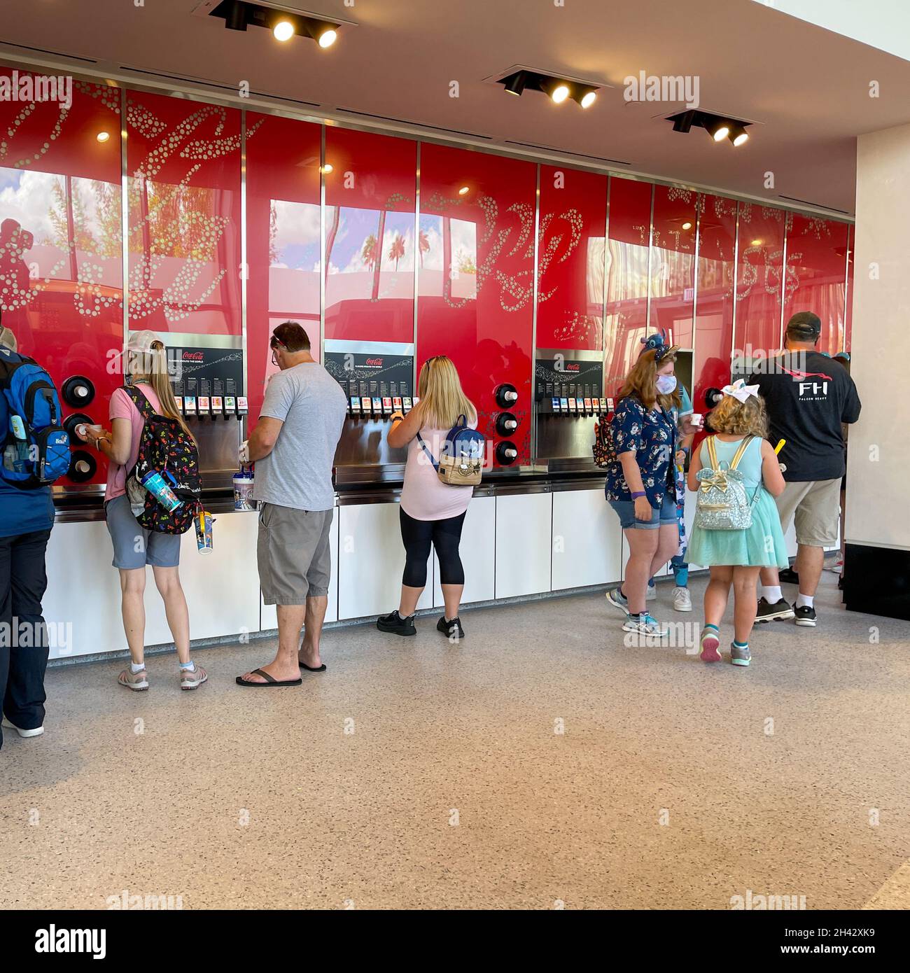 Orlando, FL USA - October 9, 2021: People pouring soda from a sample ...