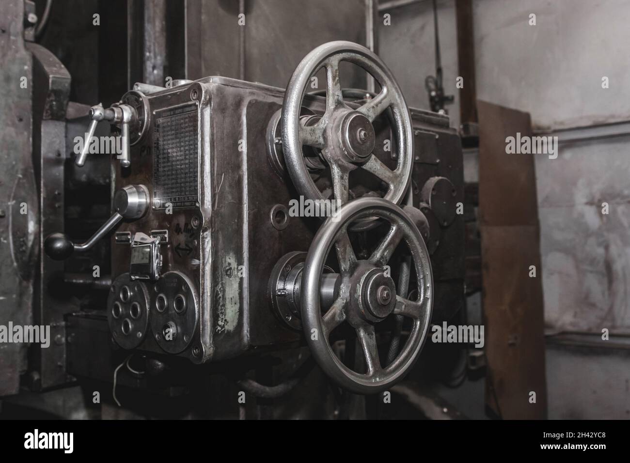 Iron round handles of the old milling machine of equipment and tools ...