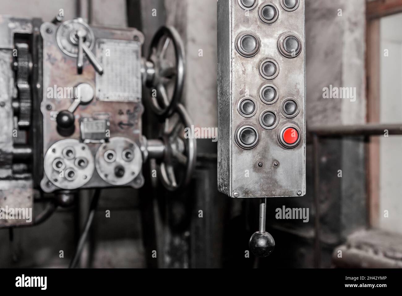 Old, dirty hanging vertical system and control panel with buttons for ...