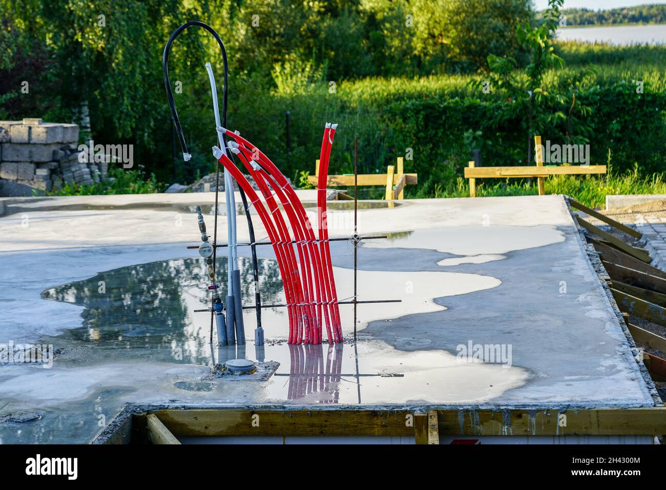 prepared cement base for a modern prefabricated house with electricity ...