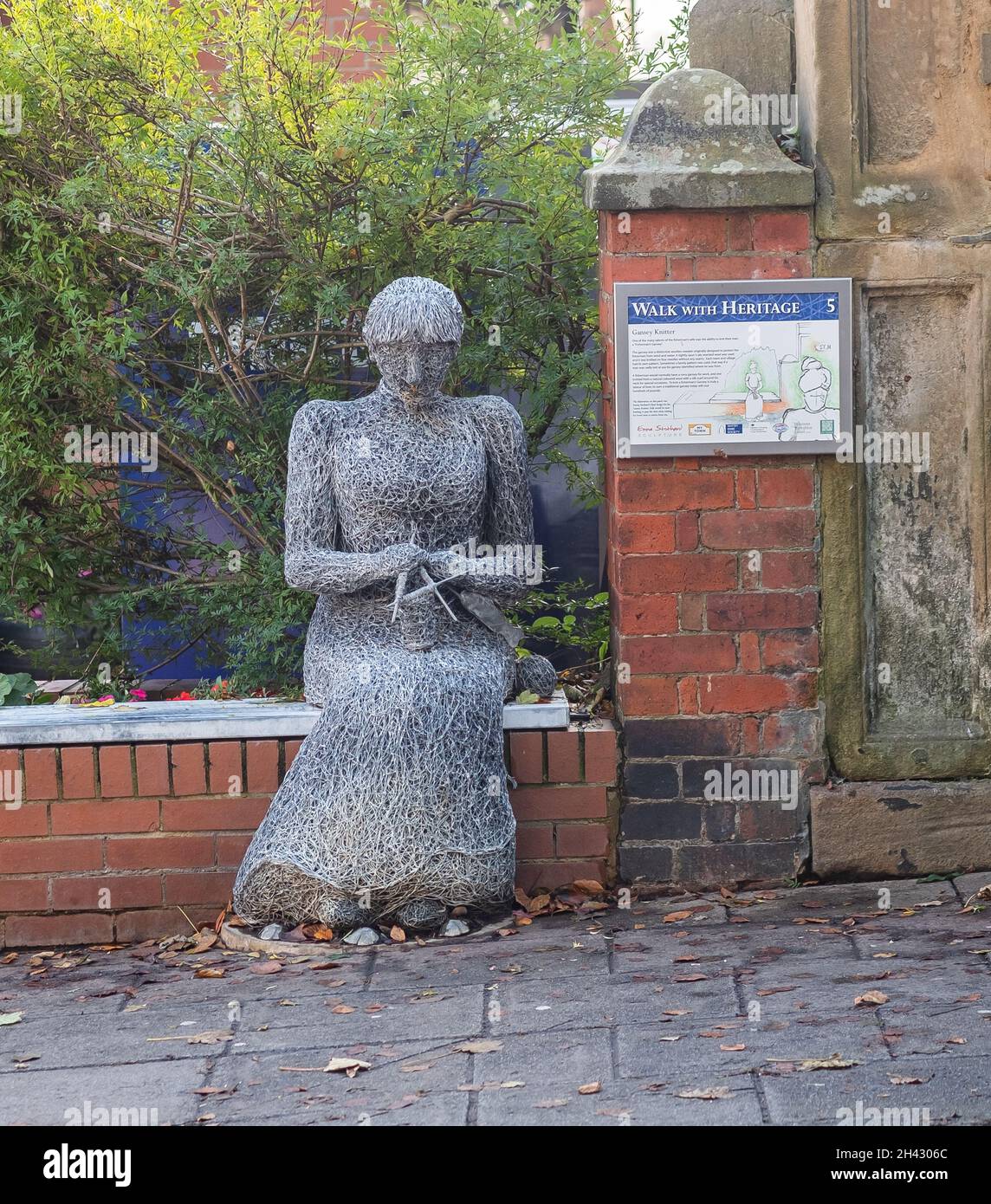 The Statue of the Gansey Knitter in Flowergate in the coastal town of ...