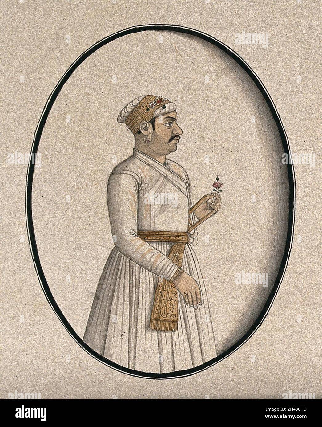 A Mughal courtier holding a flower. Watercolour drawing by an Indian ...