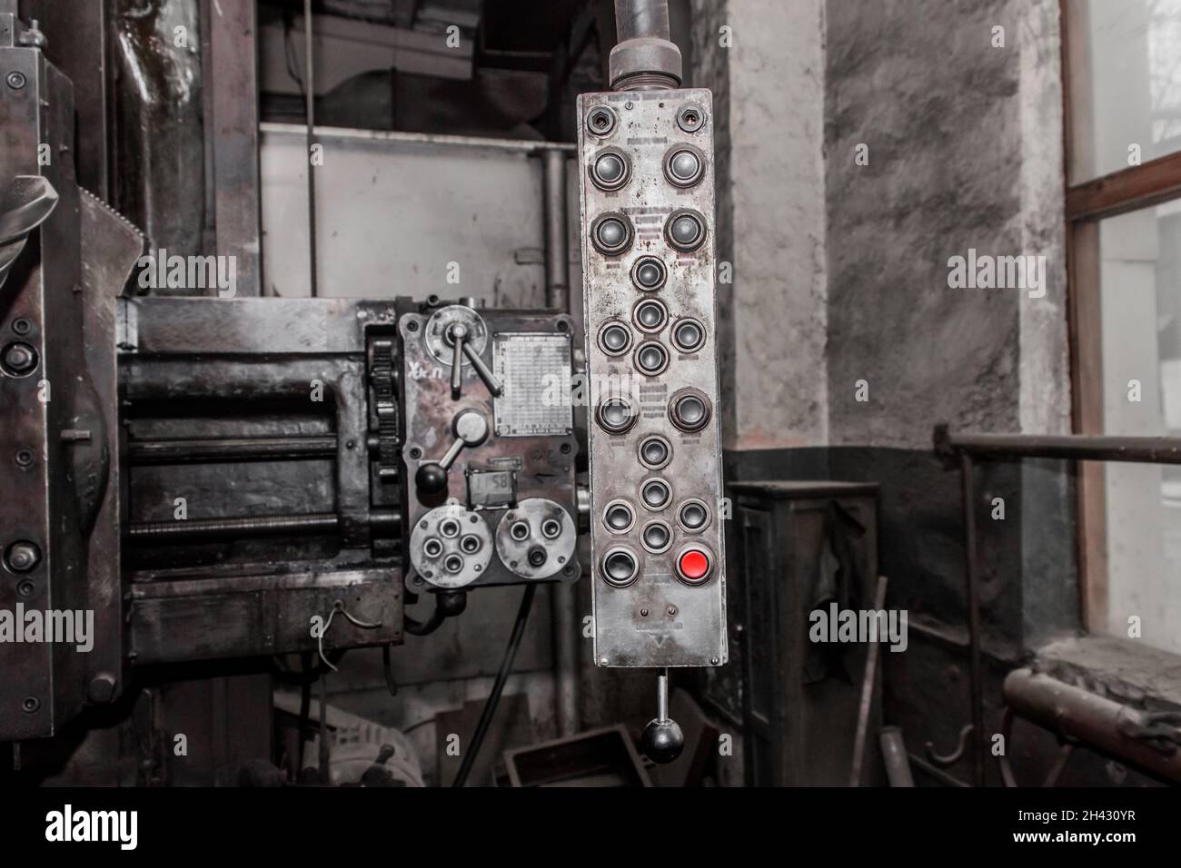 Old, dirty hanging vertical system and control panel with buttons for ...