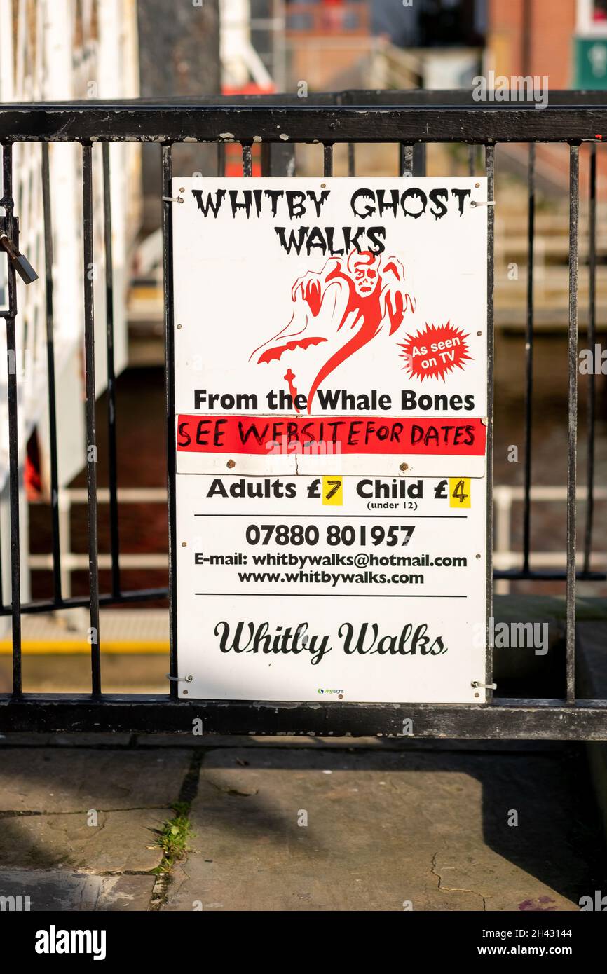 Sign advertising the Whitby Ghost Walk in the seaside town of Whitby in ...