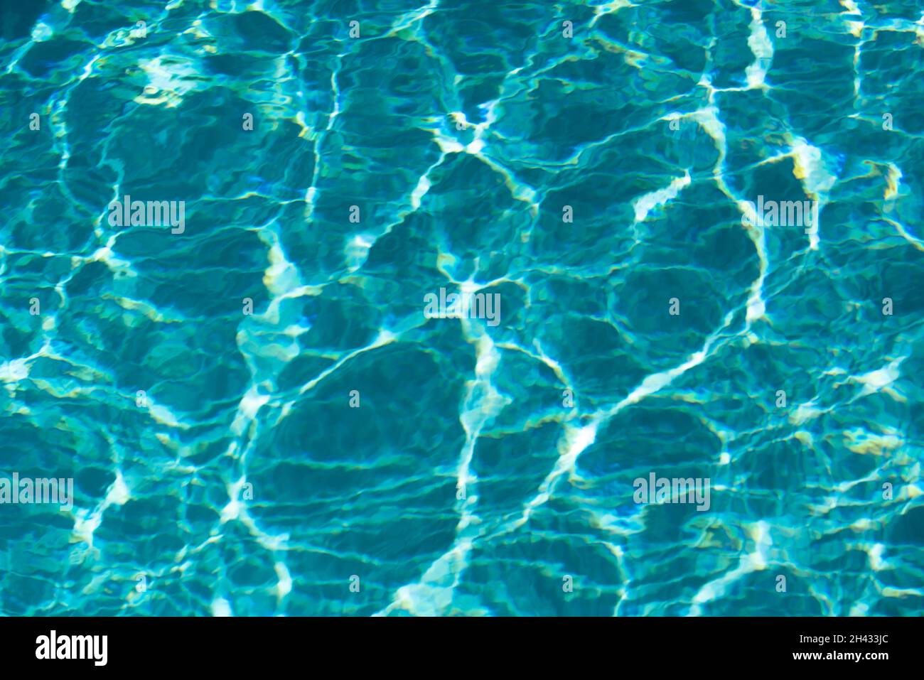 Abstract ripple wave and clear turquoise water surface in swimming pool ...