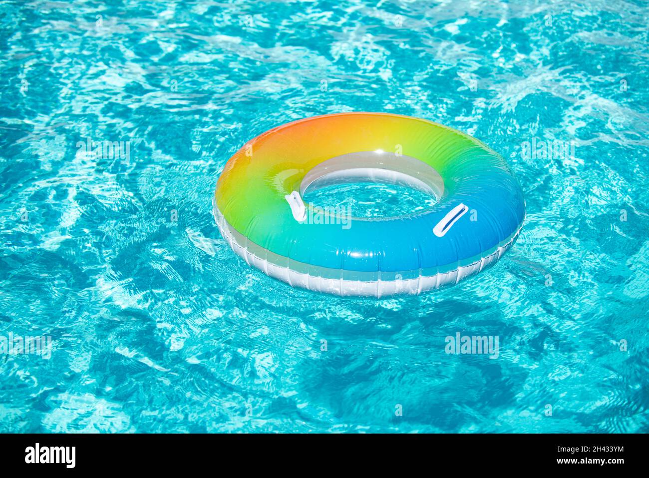 Aqua textured. Pool float, ring floating in a refreshing blue swimming ...
