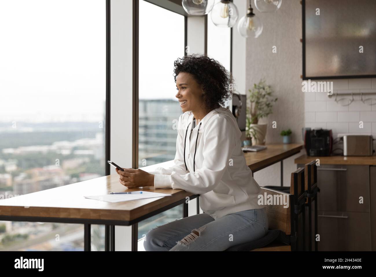 Thoughtful african american woman typing hi-res stock photography and ...