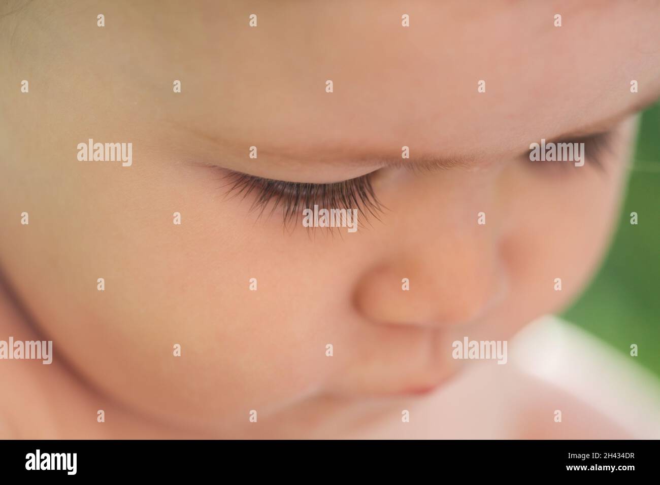 Macro eyelash. Portrait of little baby boy, cropped face with long ...