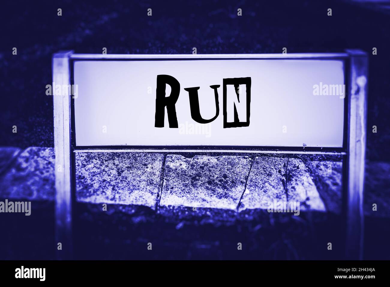 Run written on a street sign in a neon blue tone Stock Photo - Alamy