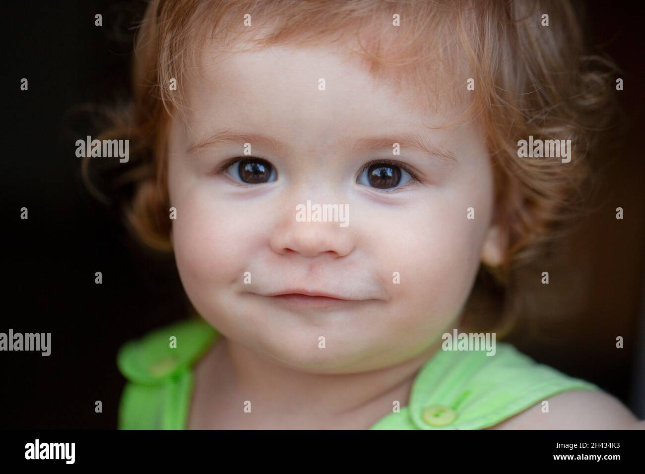 Funny baby face close up. Kids head portrait Stock Photo - Alamy