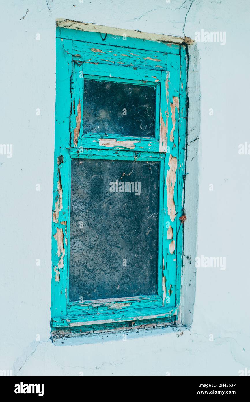 Old shabby window in building. Neglected dirty window with wooden frame ...