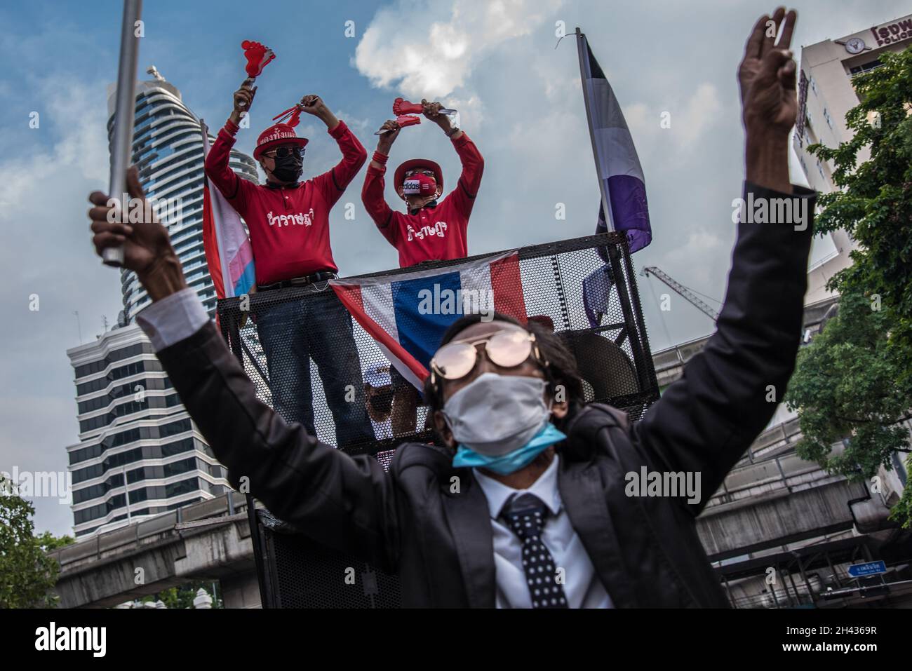 A protester makes three finger salute during the demonstration.Thousand ...