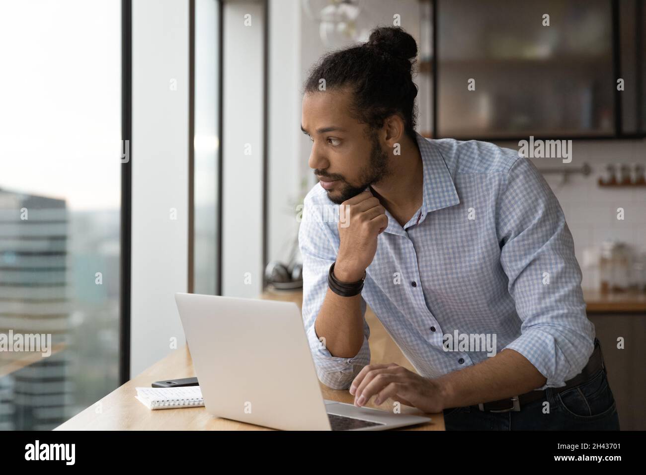 Stressed young african american businessman considering problem ...