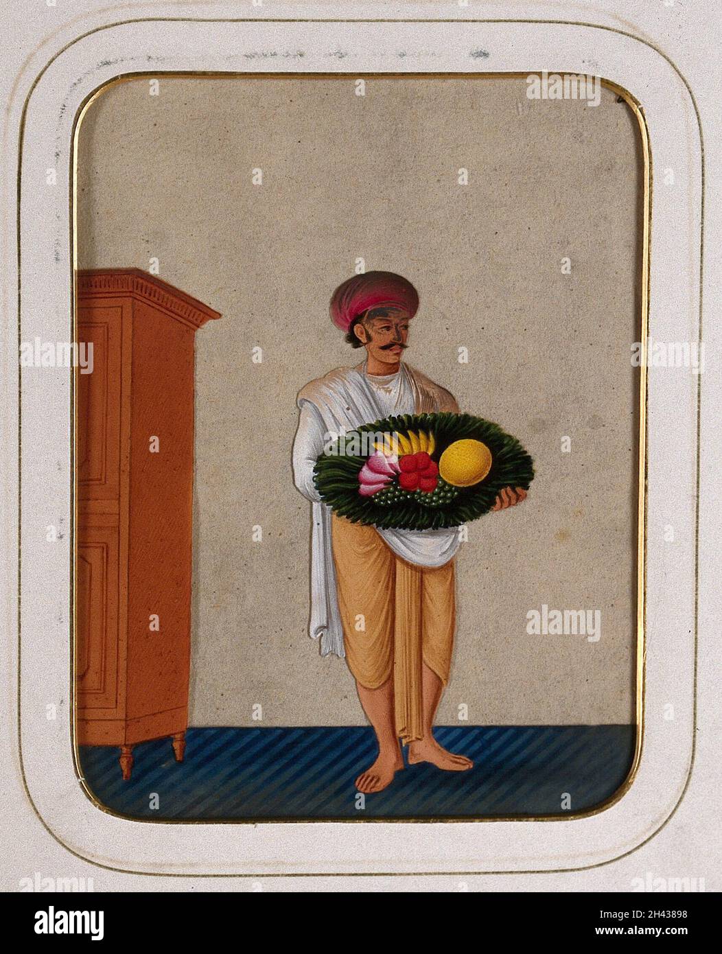 A servant holding a platter of fruit. Gouache painting on mica by an ...