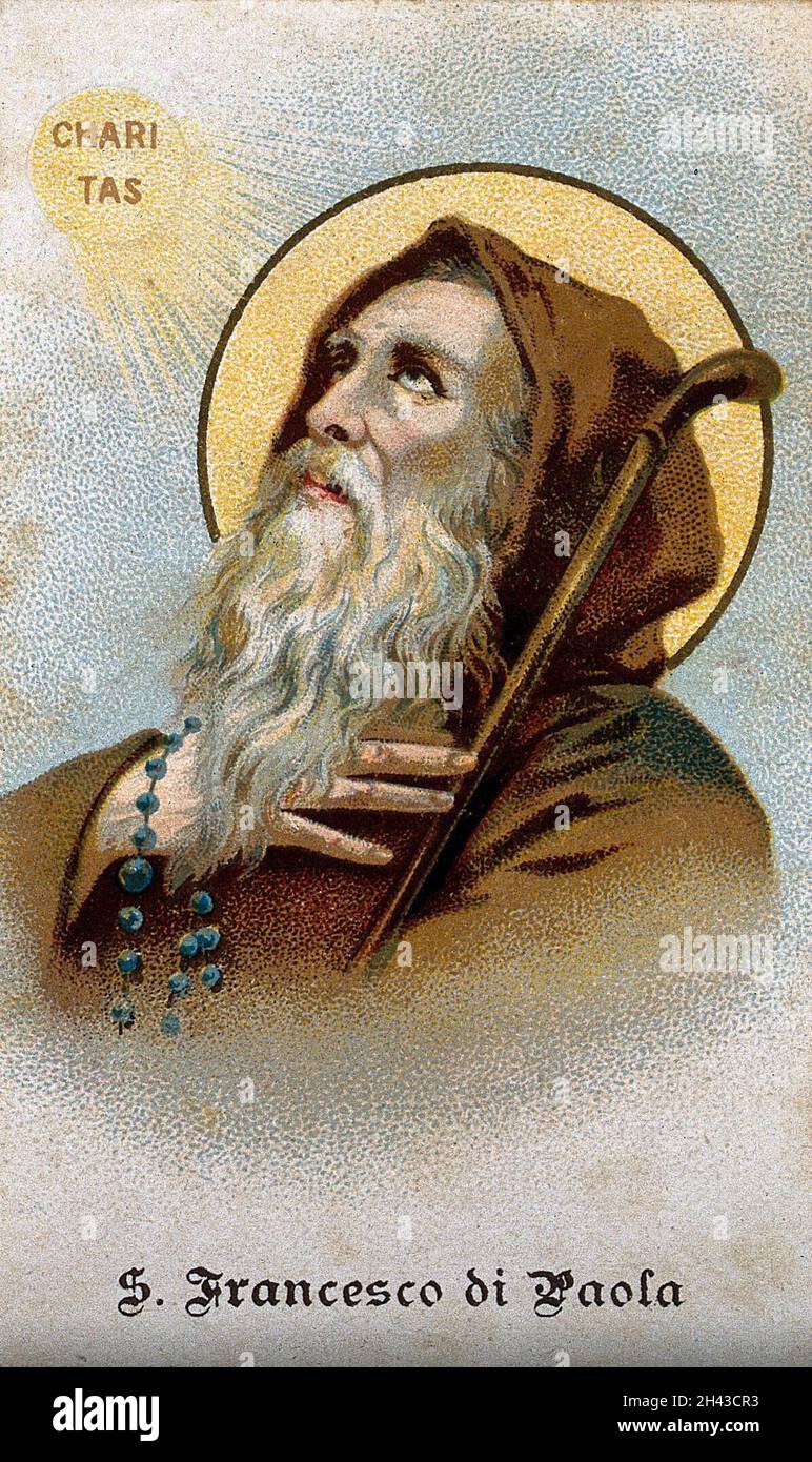 Saint Francis of Paula holding a rosary and looking at the sun. Colour ...