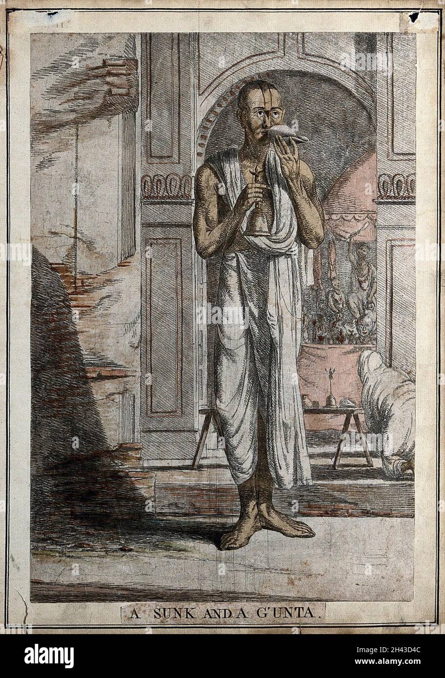 Brahman priest with a musical shell and a bell, being used at a ...