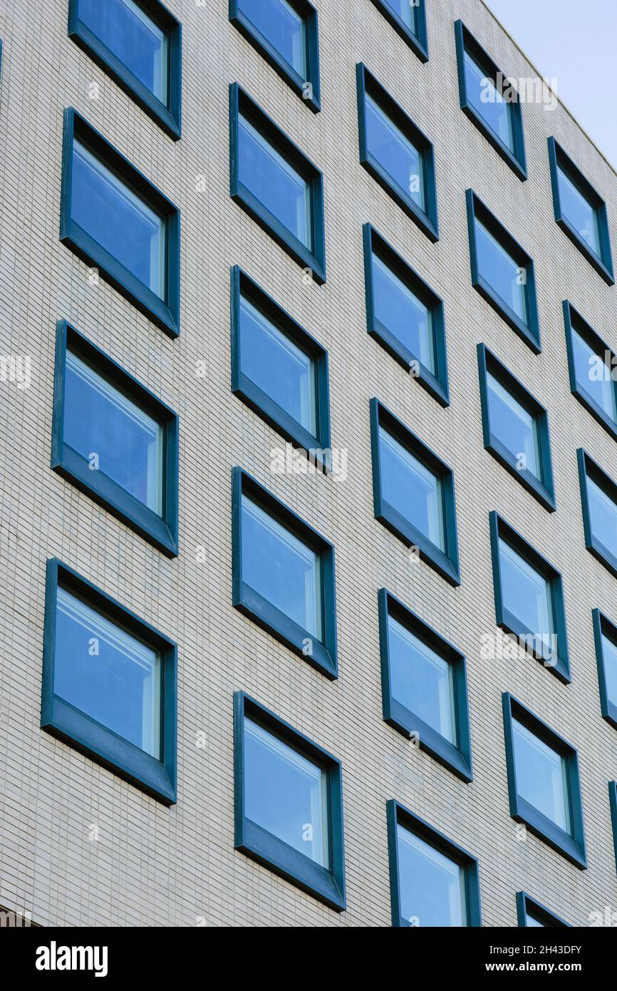 Grid of hotel room windows on the South facade. Radisson RED Rosebank ...