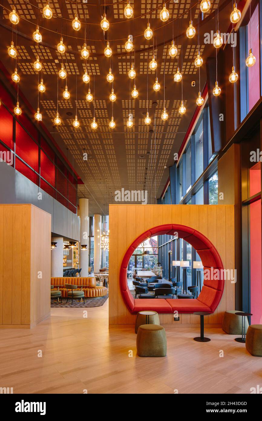 Reception interior with custom chandelier and furnishing. Radisson RED ...