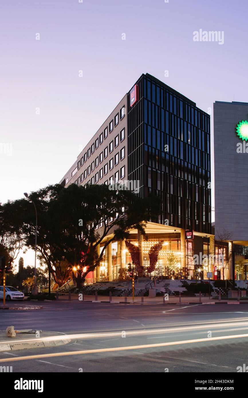The hotel East and South facades with lit up restaurant seen from ...