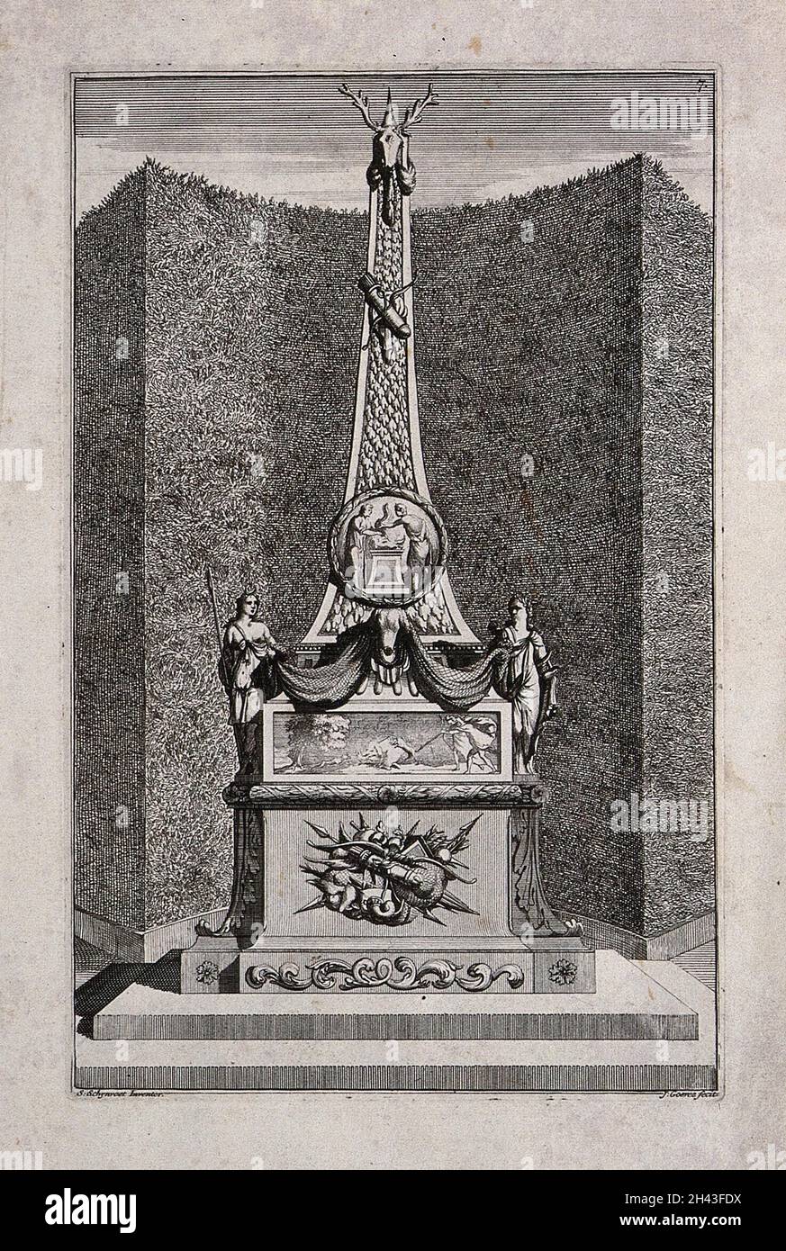 An ornate garden obelisk with carvings depicting hunting scenes and ...