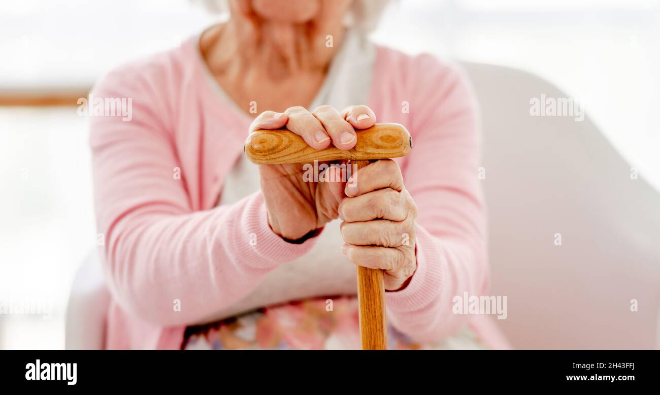 Elderly caucasian woman with walking stick hi-res stock photography and ...