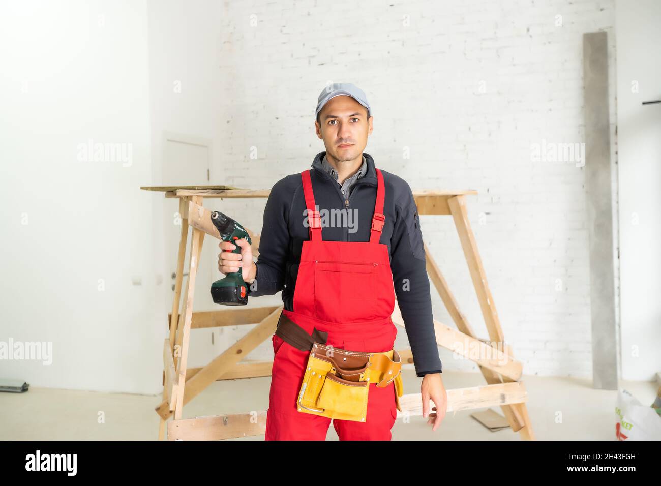 Electrician working at plug socket in the building Stock Photo - Alamy