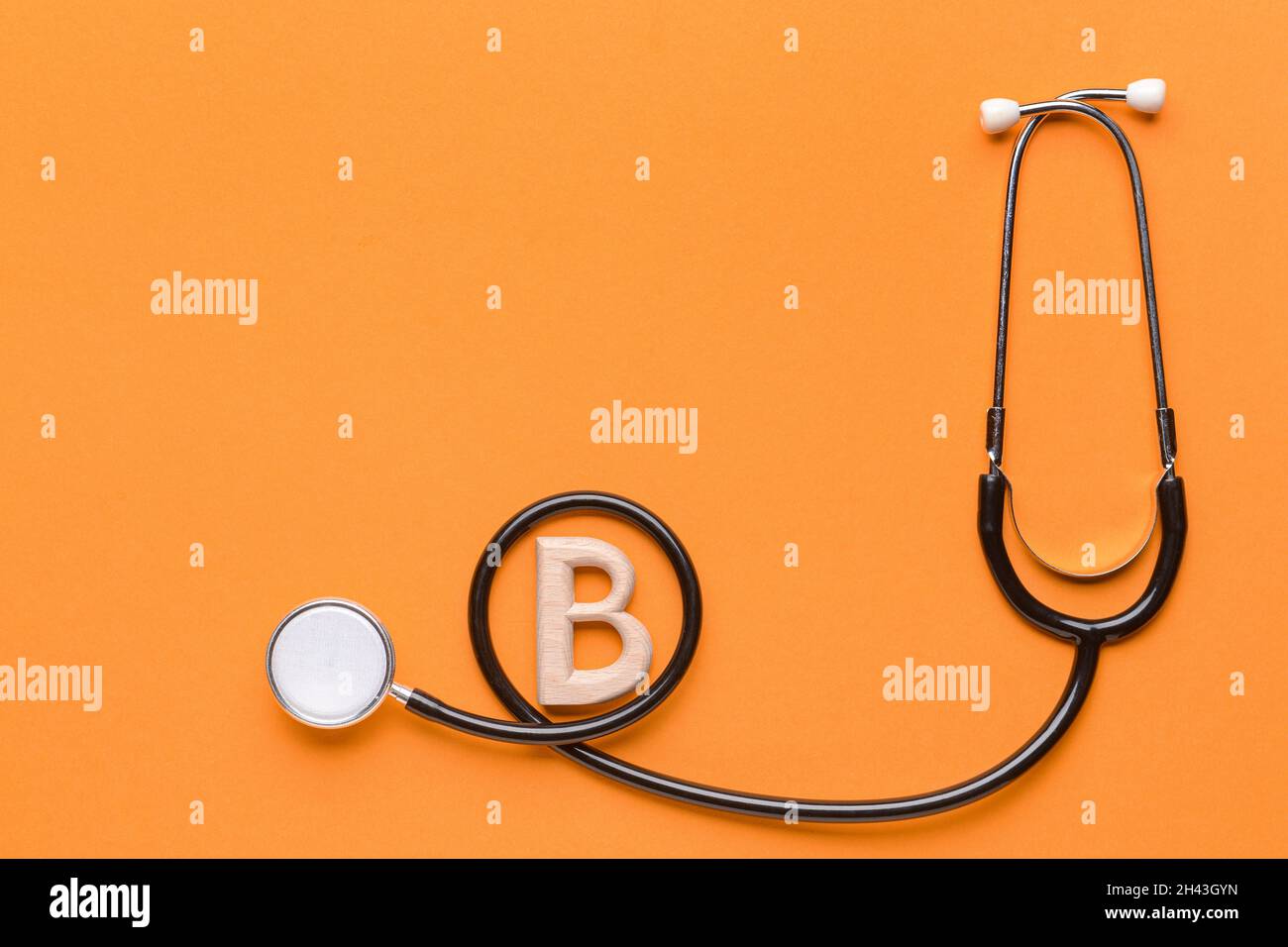 Letter B with stethoscope on color background Stock Photo - Alamy