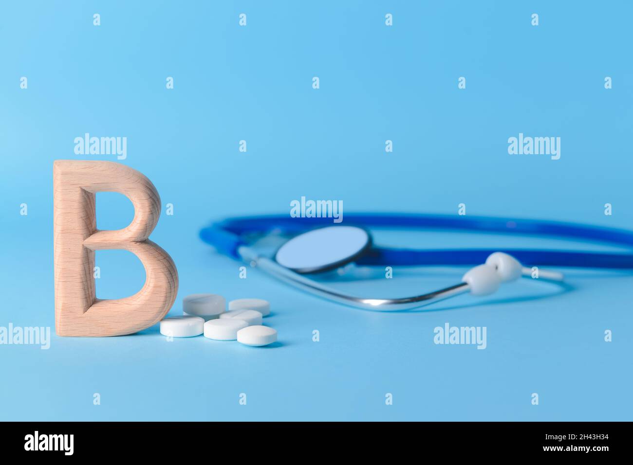 Letter B with pills and stethoscope on color background Stock Photo - Alamy