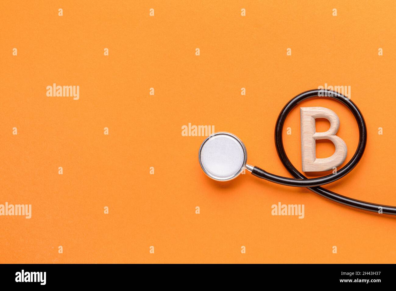 Letter B with stethoscope on color background Stock Photo - Alamy